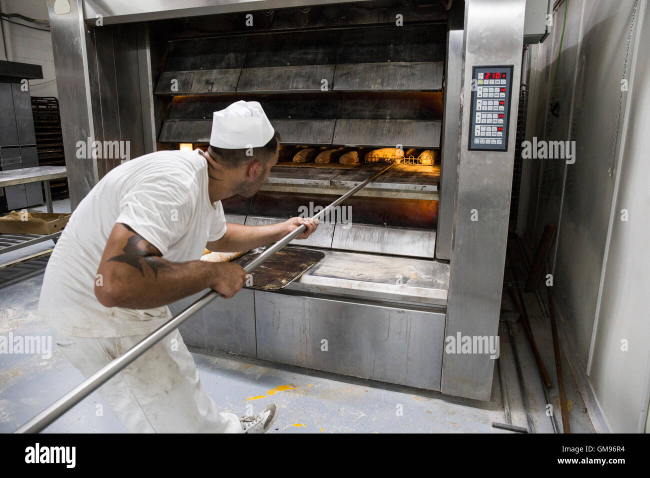 Man taking baked bread from hi-res stock photography and images - Alamy