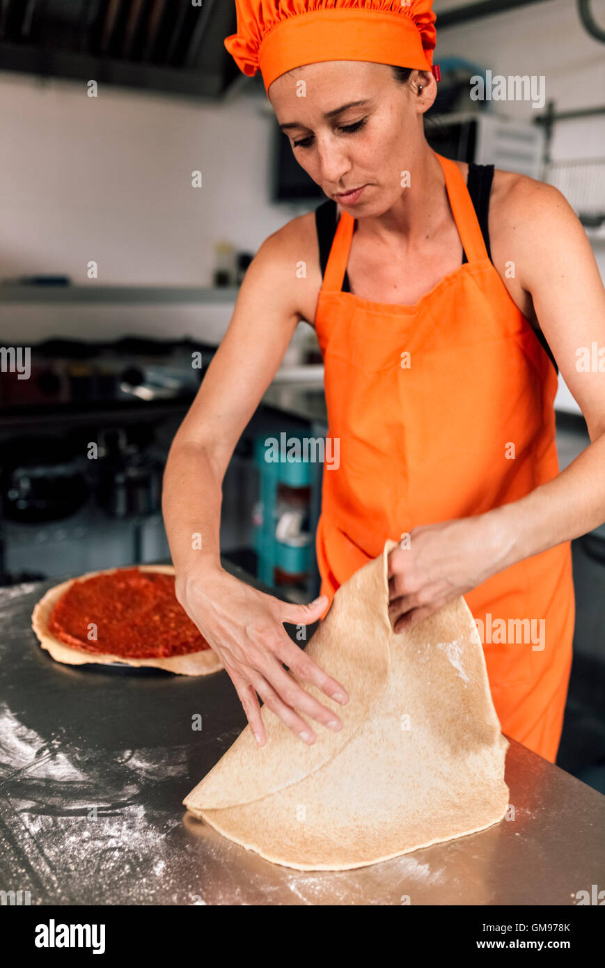 Pizza baker at work Stock Photo - Alamy