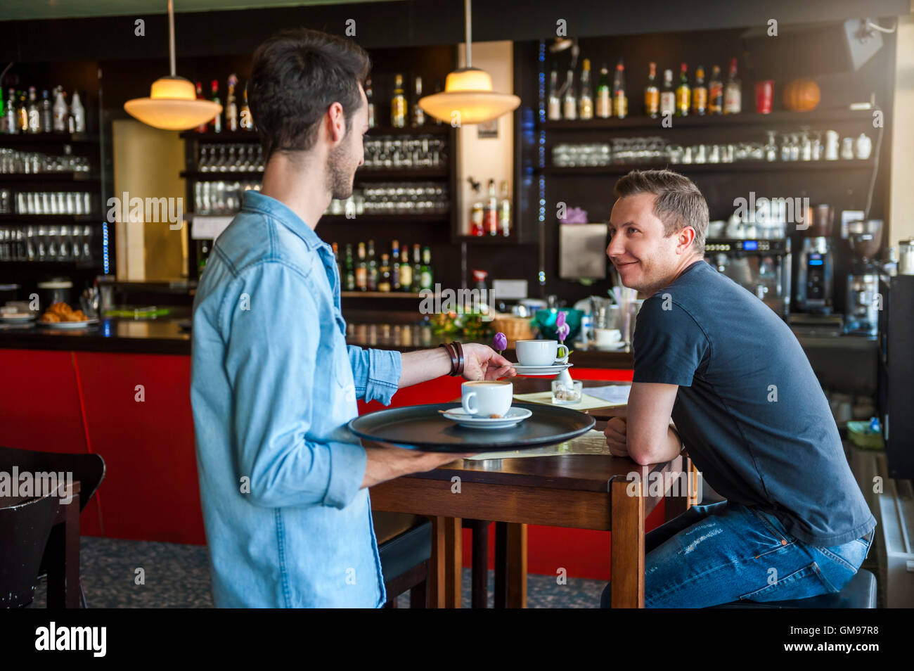 Cafe waiter serving tray hi-res stock photography and images - Alamy