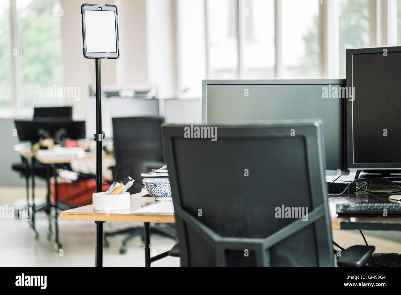 Video conference stand in empty office room with computers Stock Photo ...