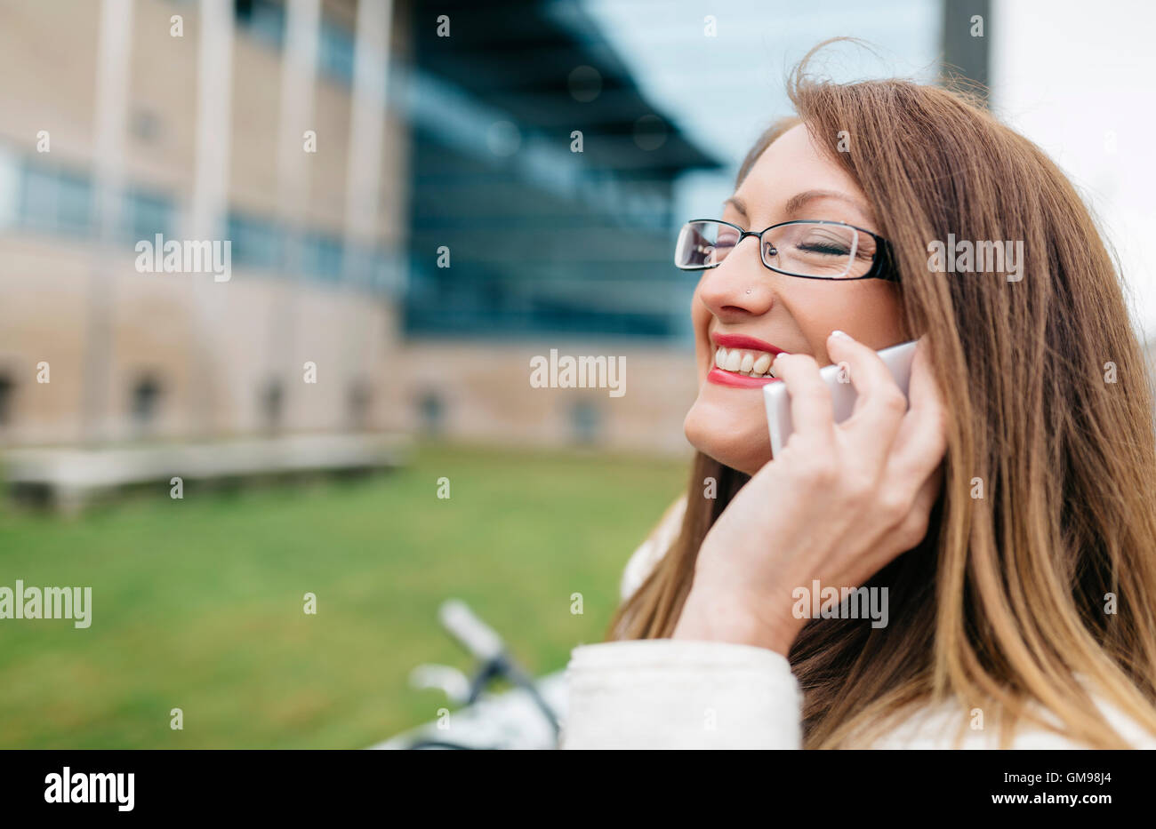 Portrait of businesswoman with glasses talking by phone Stock Photo - Alamy