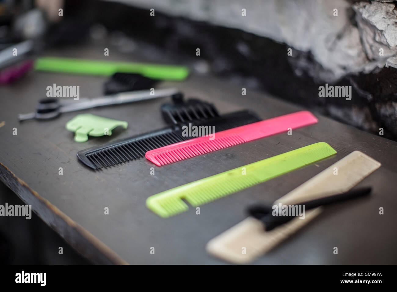 Combs and equipment laid out on table at barbershop Stock Photo - Alamy