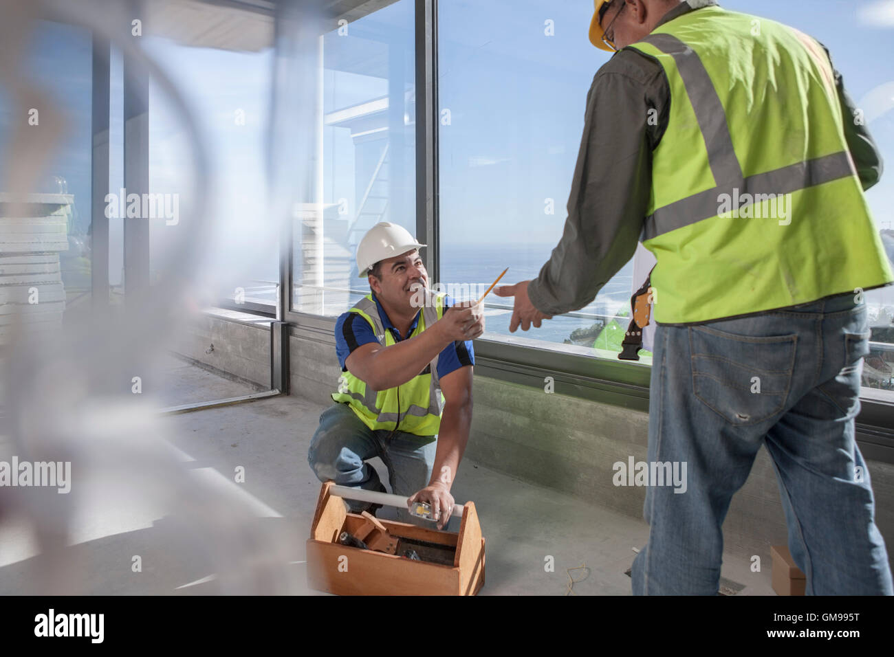 Two construction workers on construction site Stock Photo - Alamy