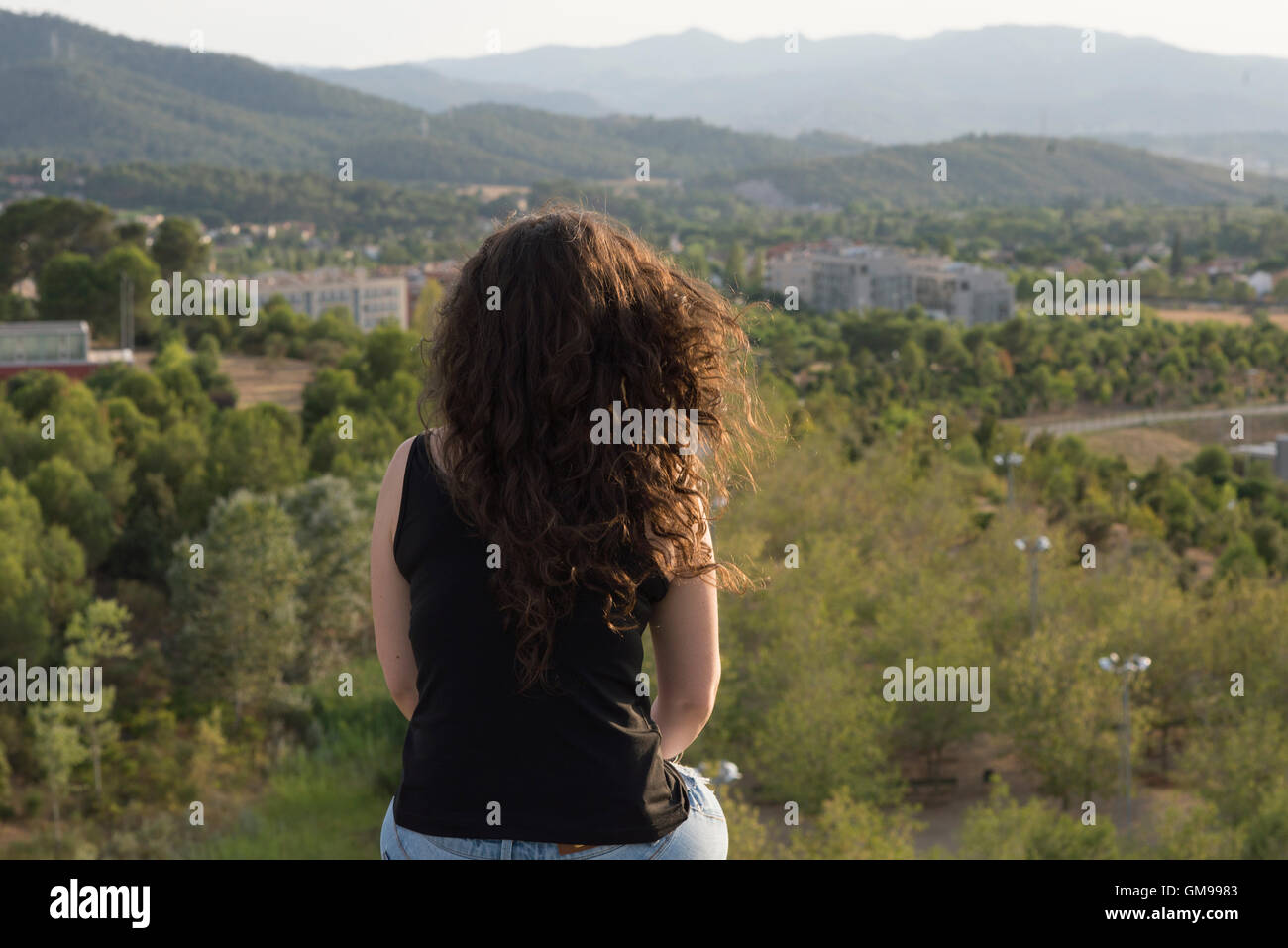 Back view of woman looking at view Stock Photo - Alamy