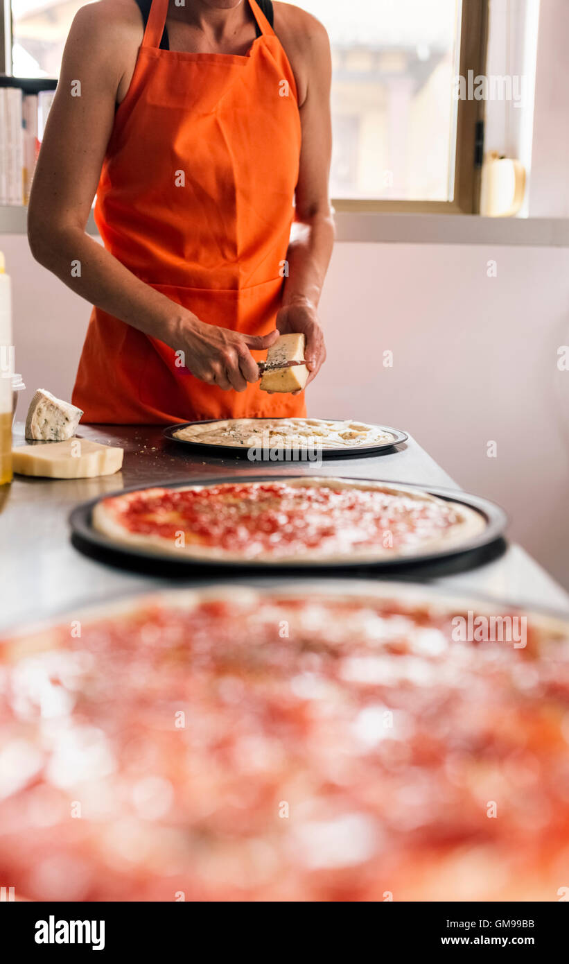 Pizza baker at work Stock Photo - Alamy