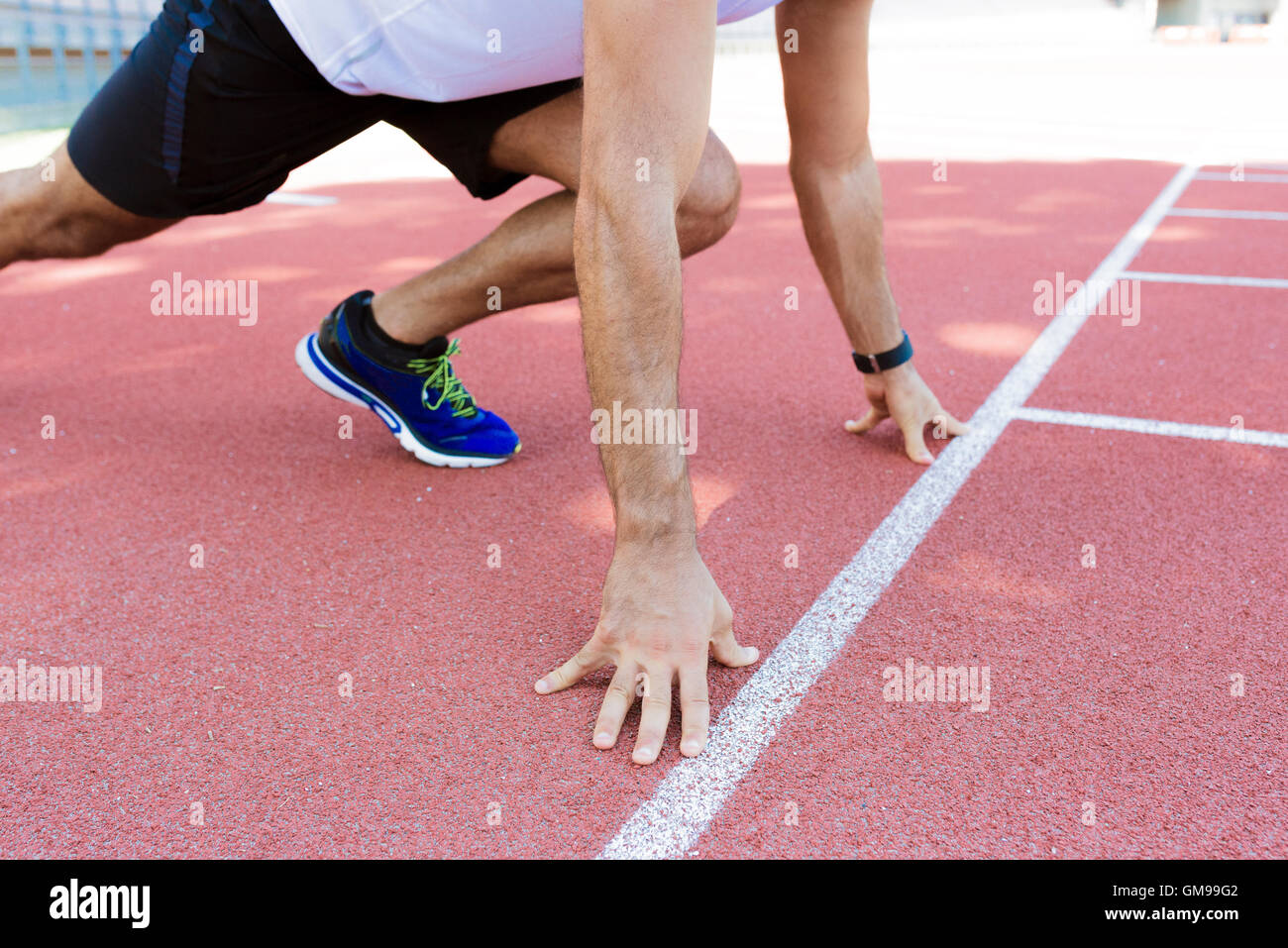 Young sportsman in starting position Stock Photo - Alamy