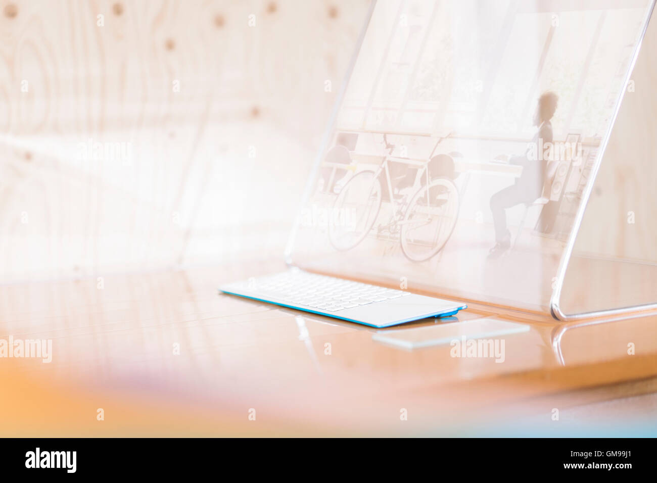 Futuristic computer in front of wooden wall Stock Photo - Alamy