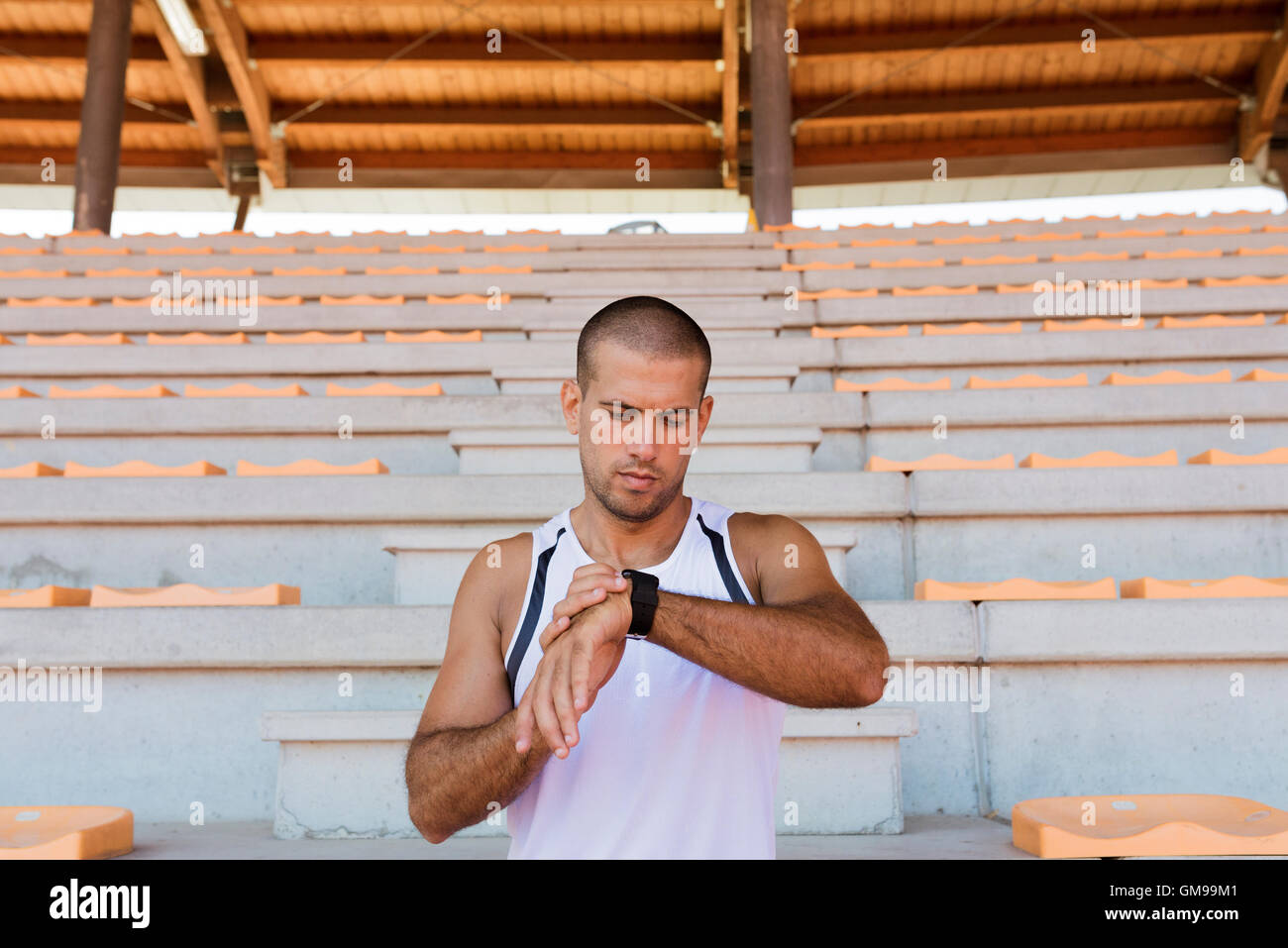 Athlete with smartwatch Stock Photo - Alamy