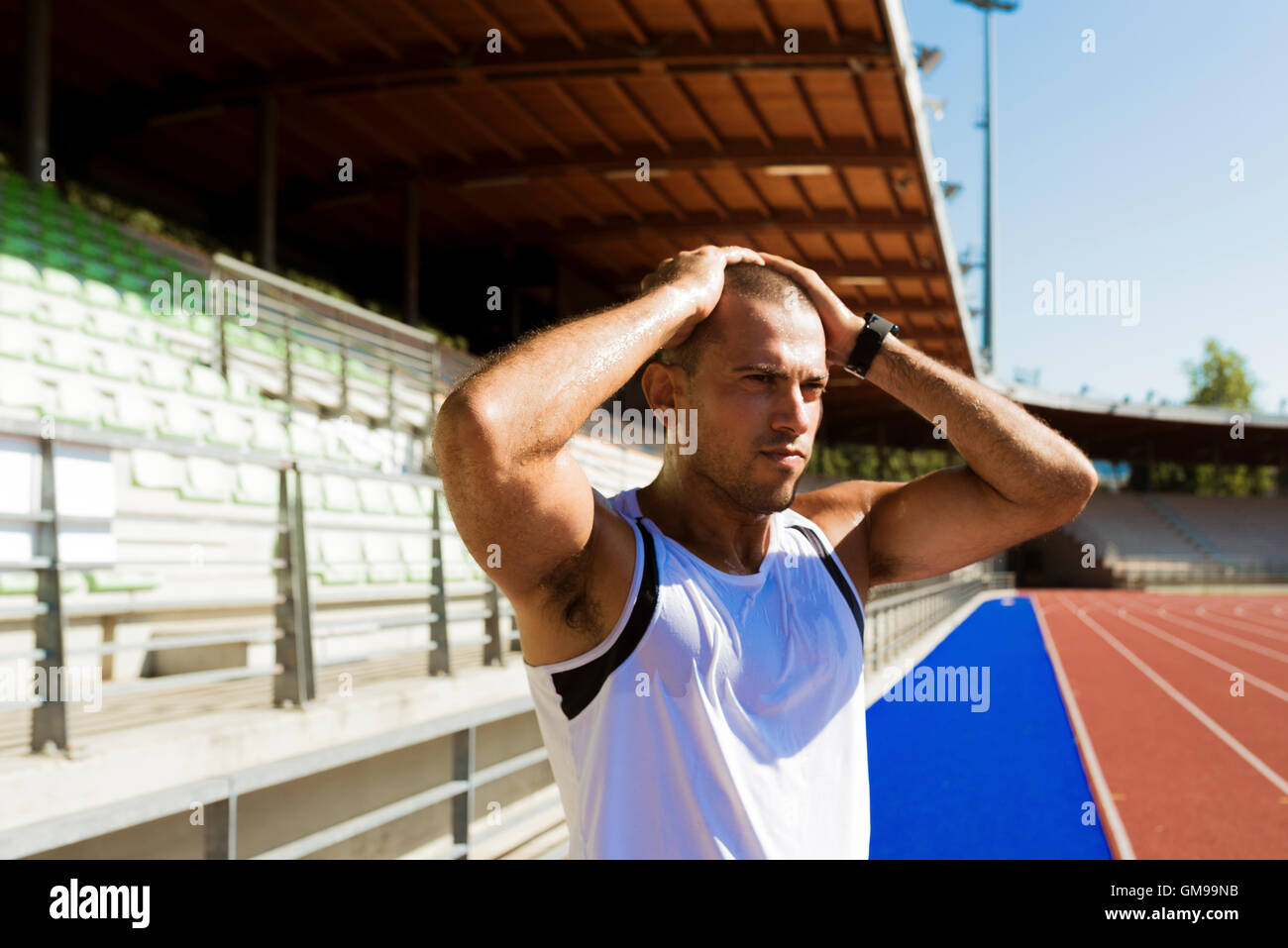 Young sportsman, hand on head Stock Photo - Alamy