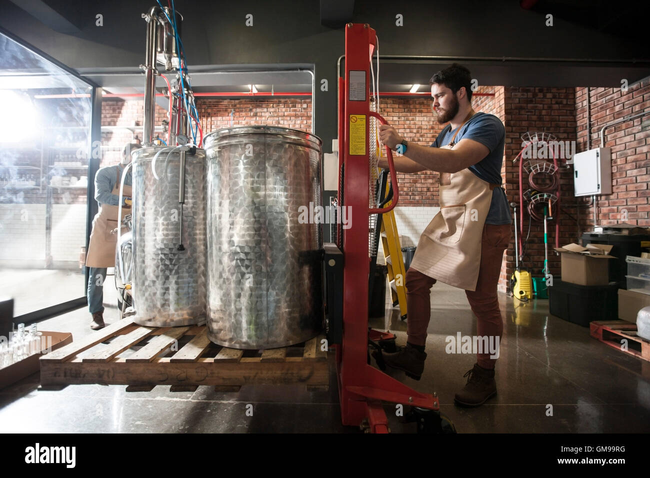 Two men working in distillery Stock Photo - Alamy