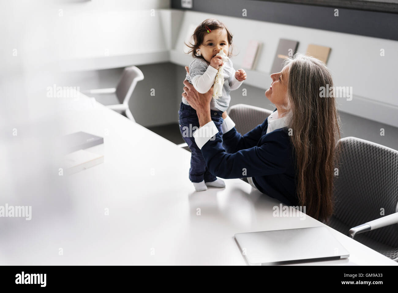 Baby at board room table hi-res stock photography and images - Alamy