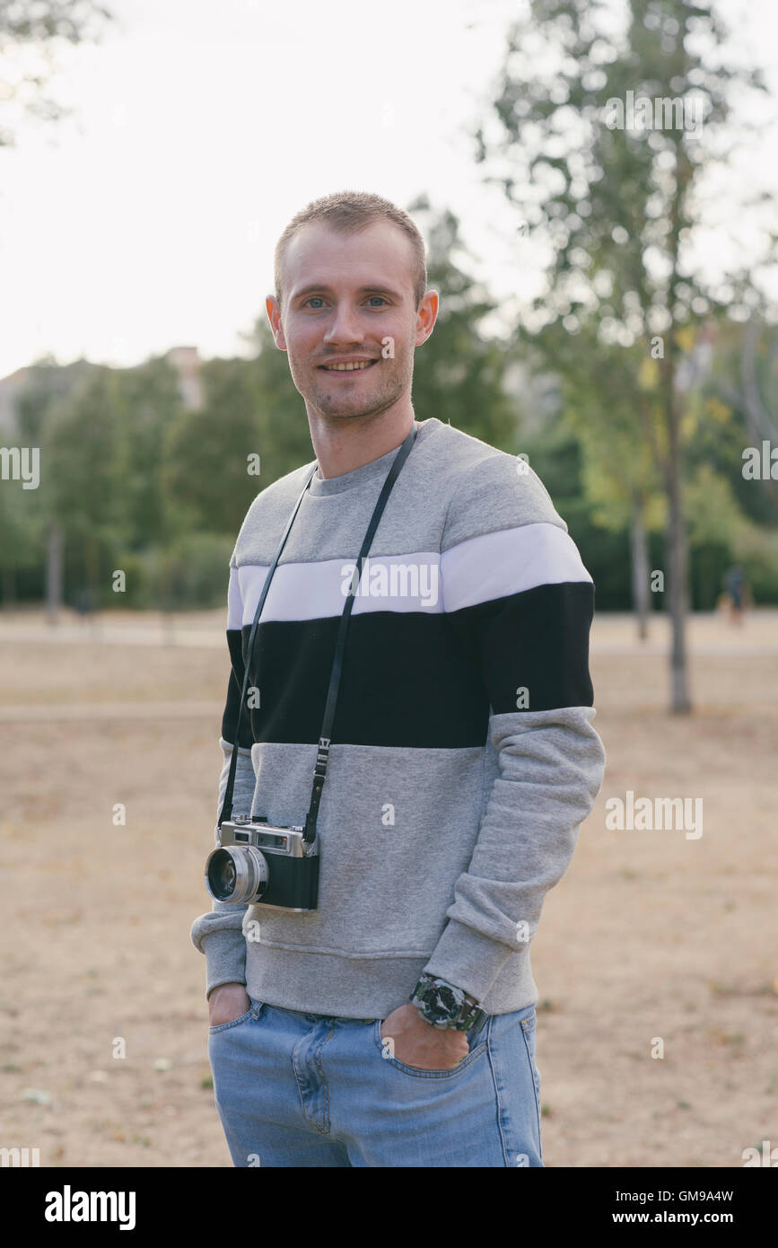 Portrait of smiling man with vintage camera Stock Photo - Alamy