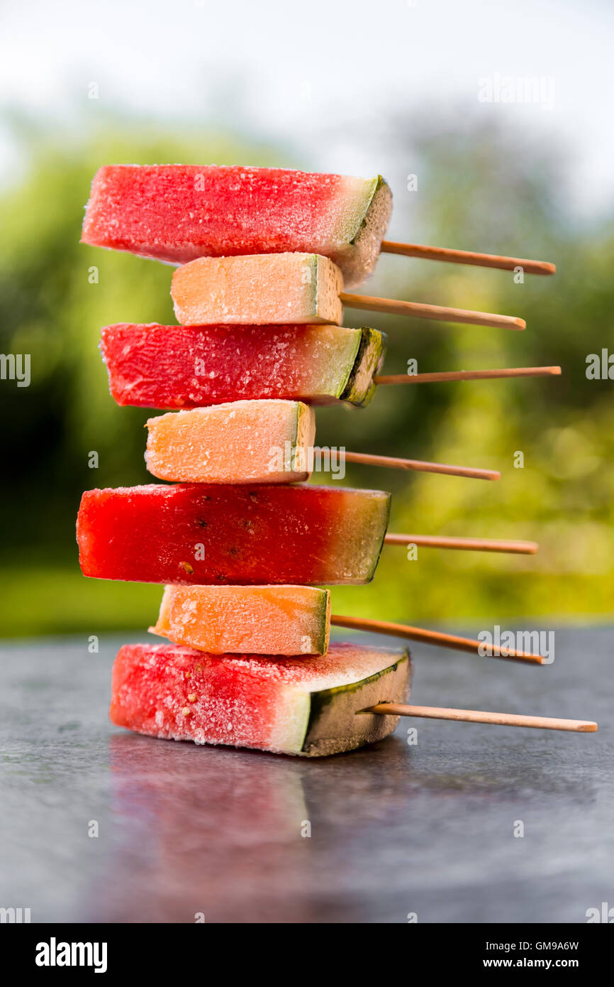 Stack of watermelon and rockmelon popsicles Stock Photo - Alamy