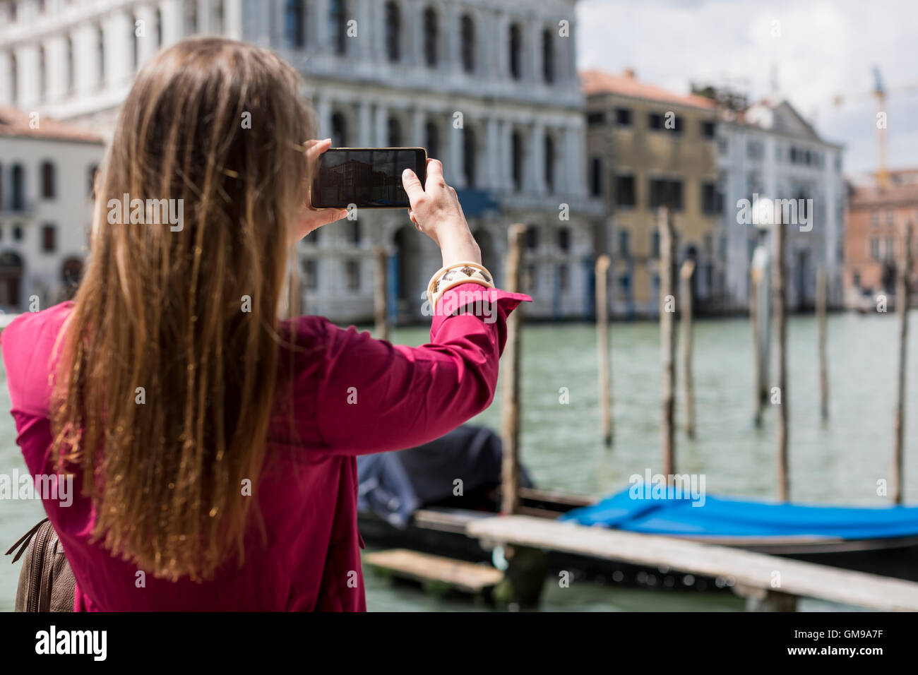 Italy, Venice, tourist taking pictures with smartphone Stock Photo - Alamy