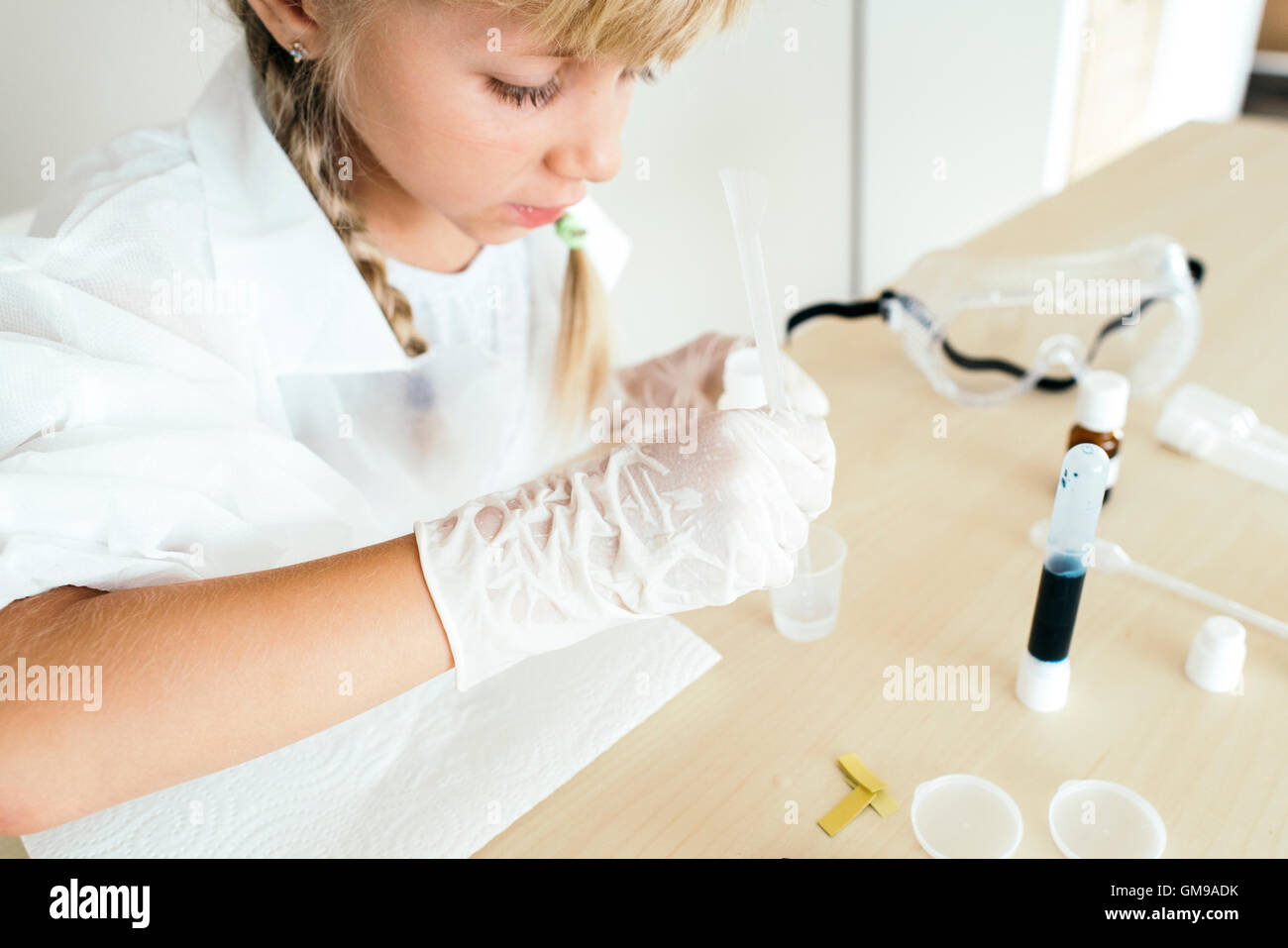 Child playing in chemical laboratory Stock Photo - Alamy
