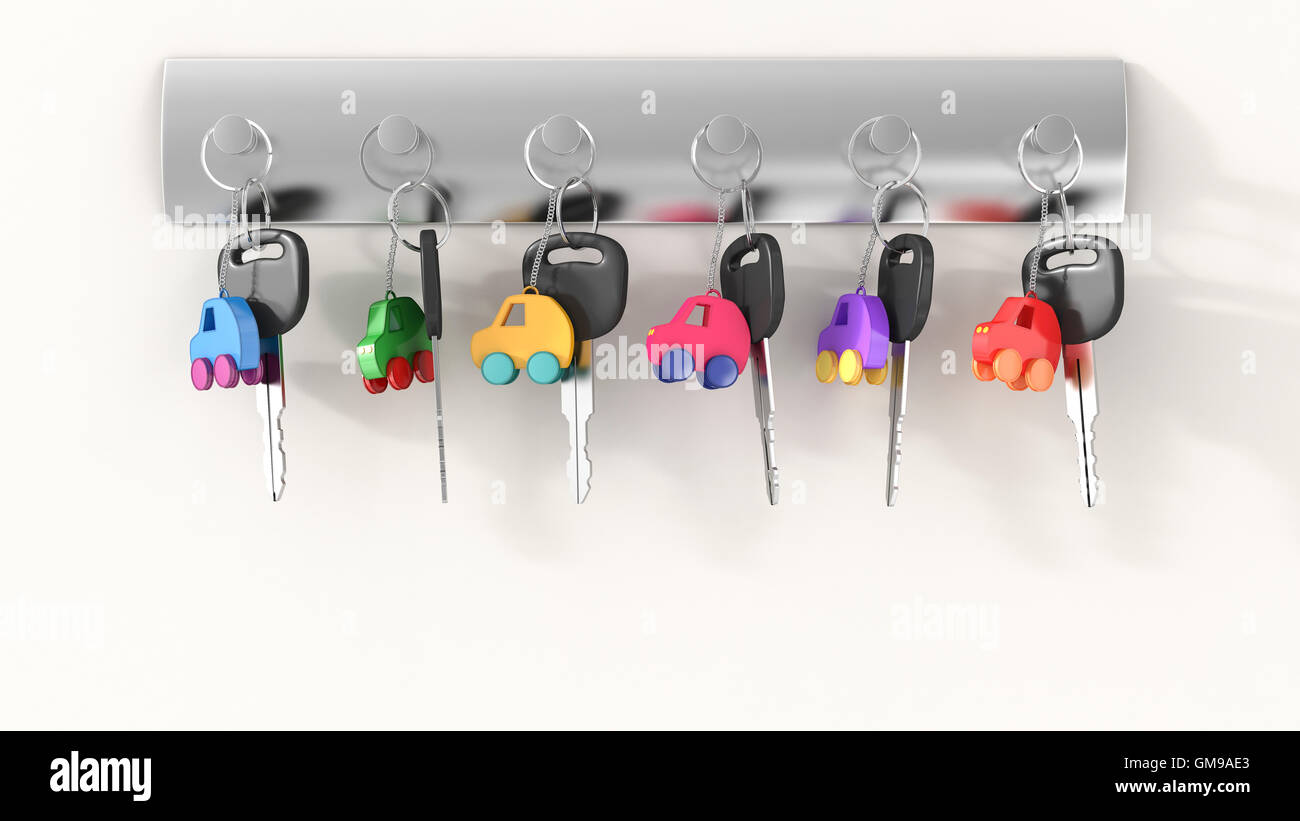 Car keys with different key ring hanging on key hook, electro car Stock ...