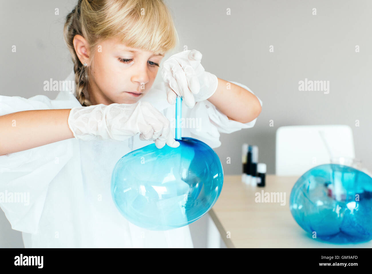 Child playing in chemical laboratory Stock Photo - Alamy