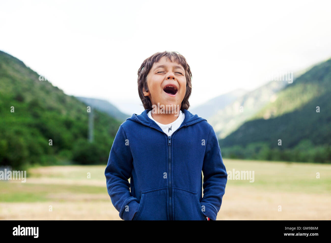 Little boy in nature screaming out loud Stock Photo - Alamy