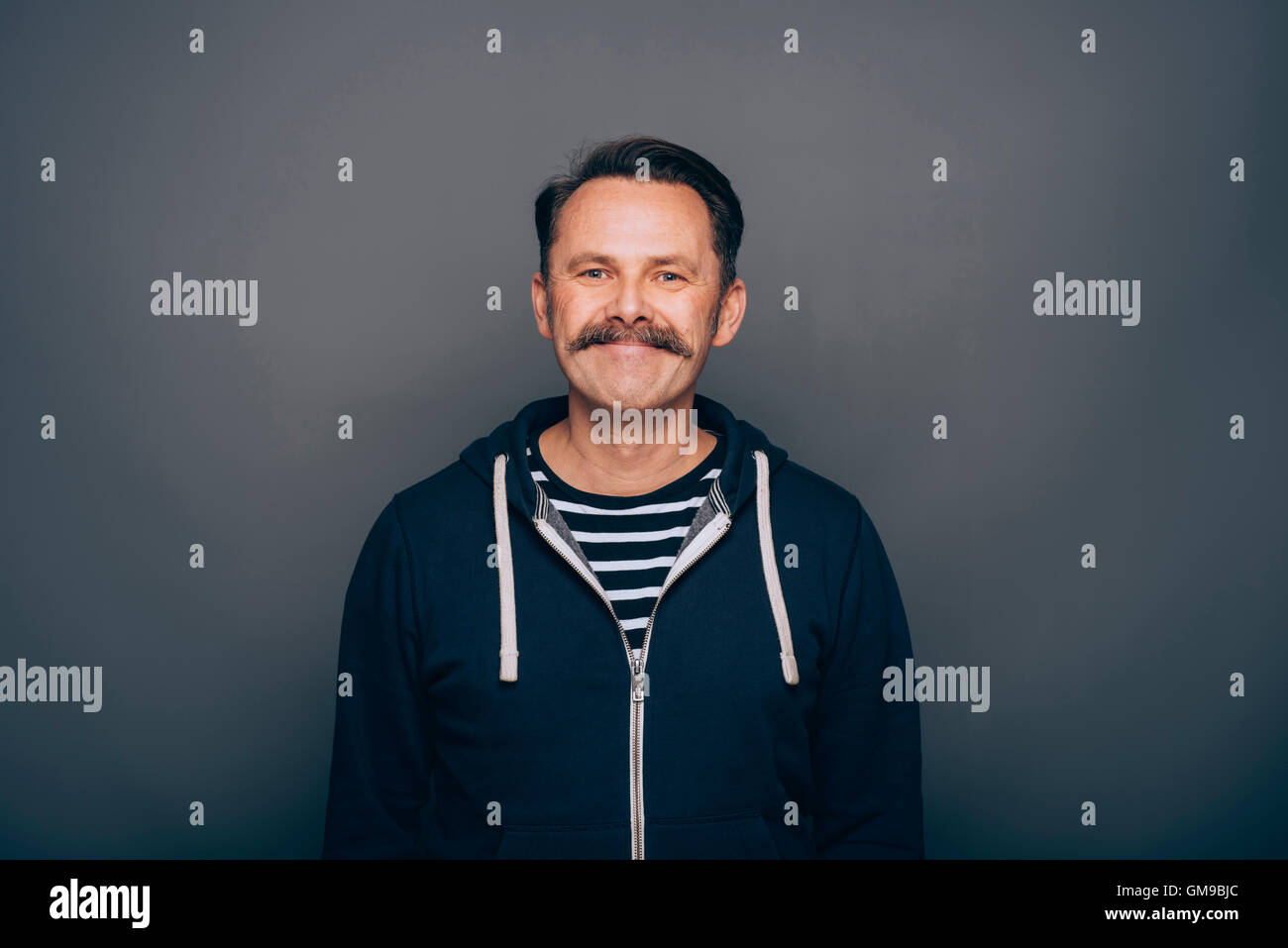 Portrait of smiling man with moustache Stock Photo - Alamy