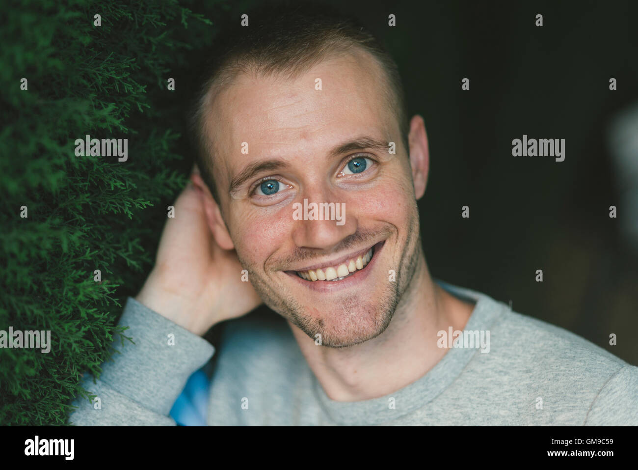 Portrait of smiling blue-eyed man Stock Photo - Alamy