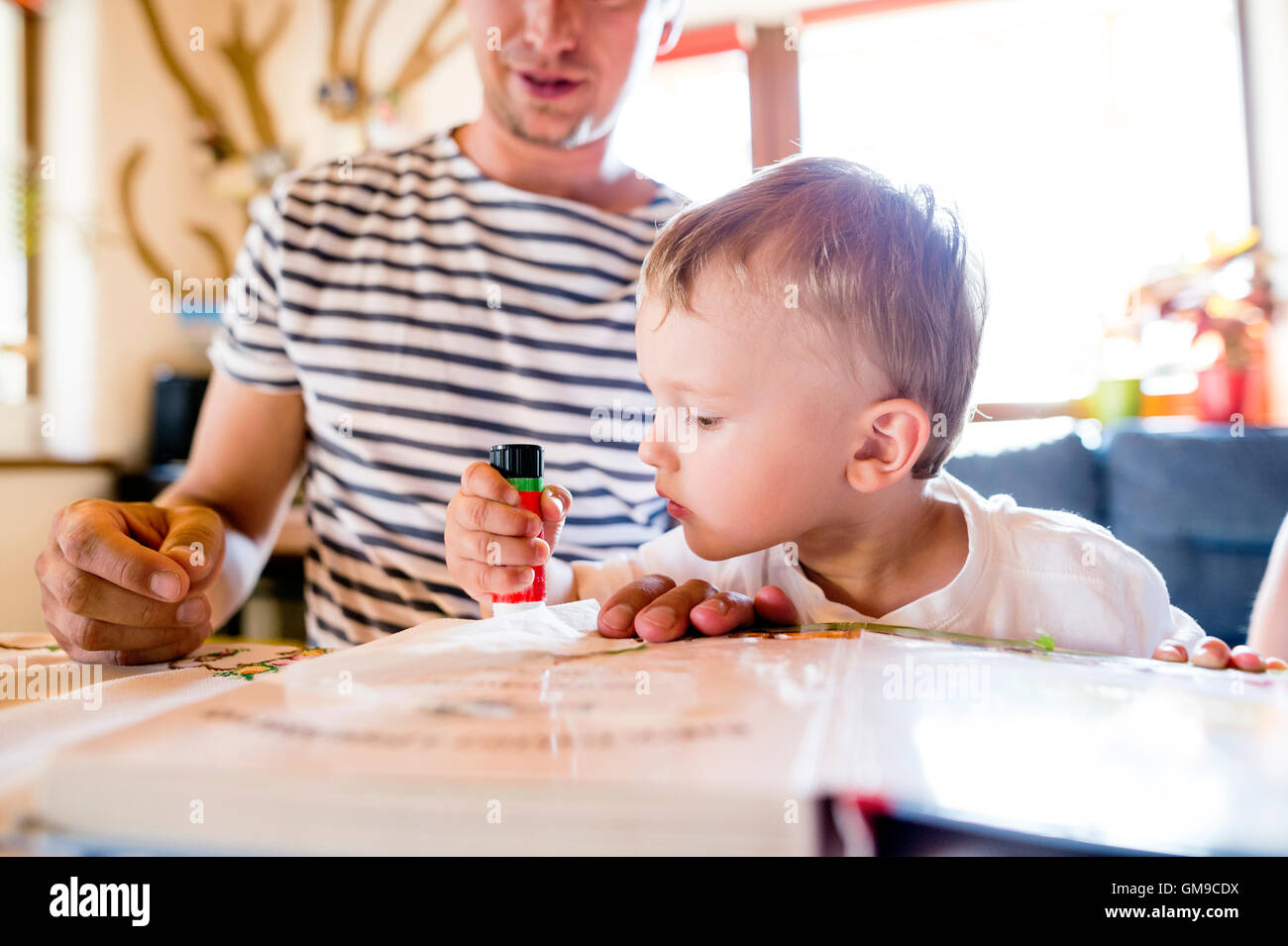 Father and son tinkering at home Stock Photo - Alamy