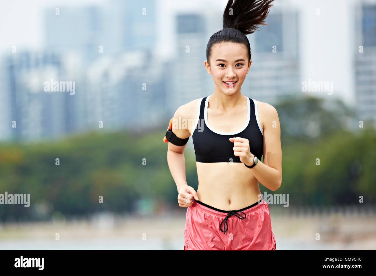 Happy chinese girl in sportswear hi-res stock photography and images ...