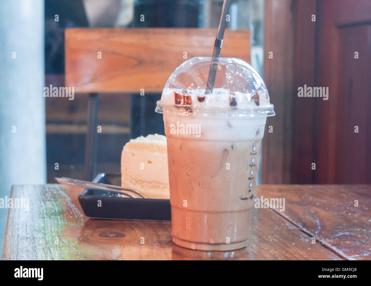 Take-home ice coffee cup on wooden table, stock photo Stock Photo - Alamy