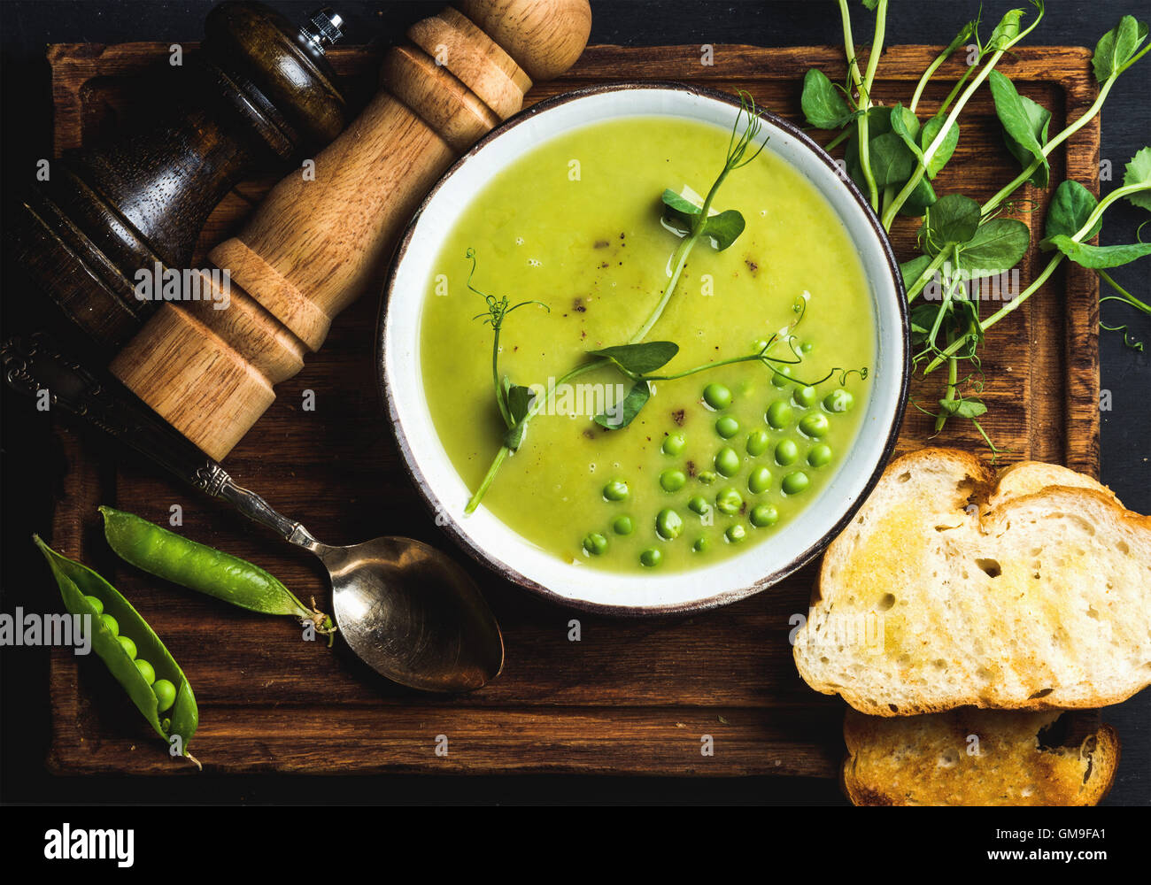Fresh homemade pea cream soup in bowl with grilled bread Stock Photo ...
