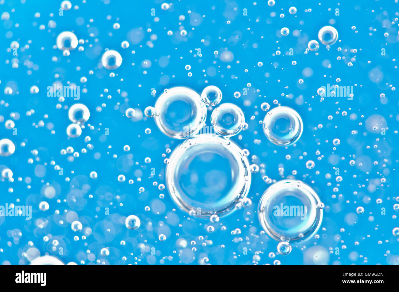 Bright bubbles under water on blue background. Macro. Concept natural ...