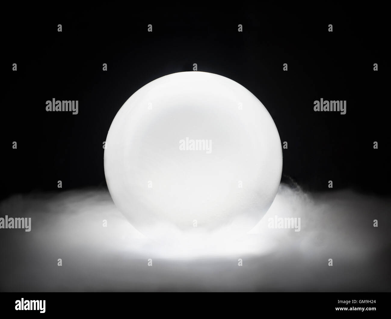 Glowing crystal ball in smoke Stock Photo - Alamy
