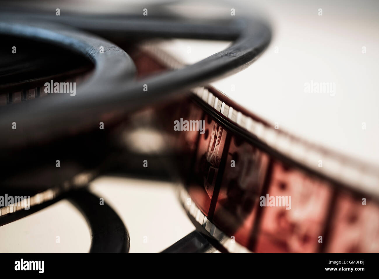 Close-up of film reel on white background Stock Photo - Alamy