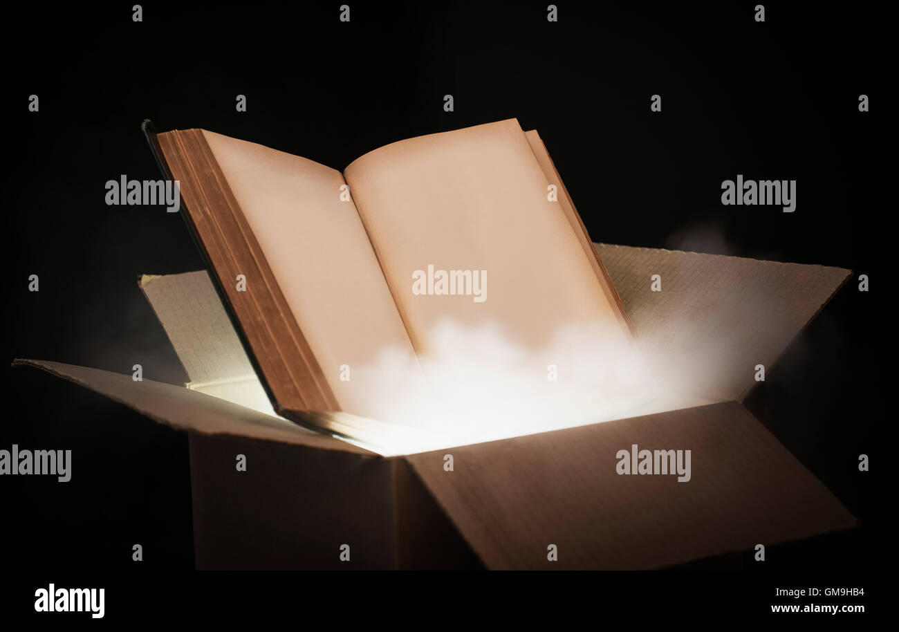 Book in an open cardboard box Stock Photo - Alamy