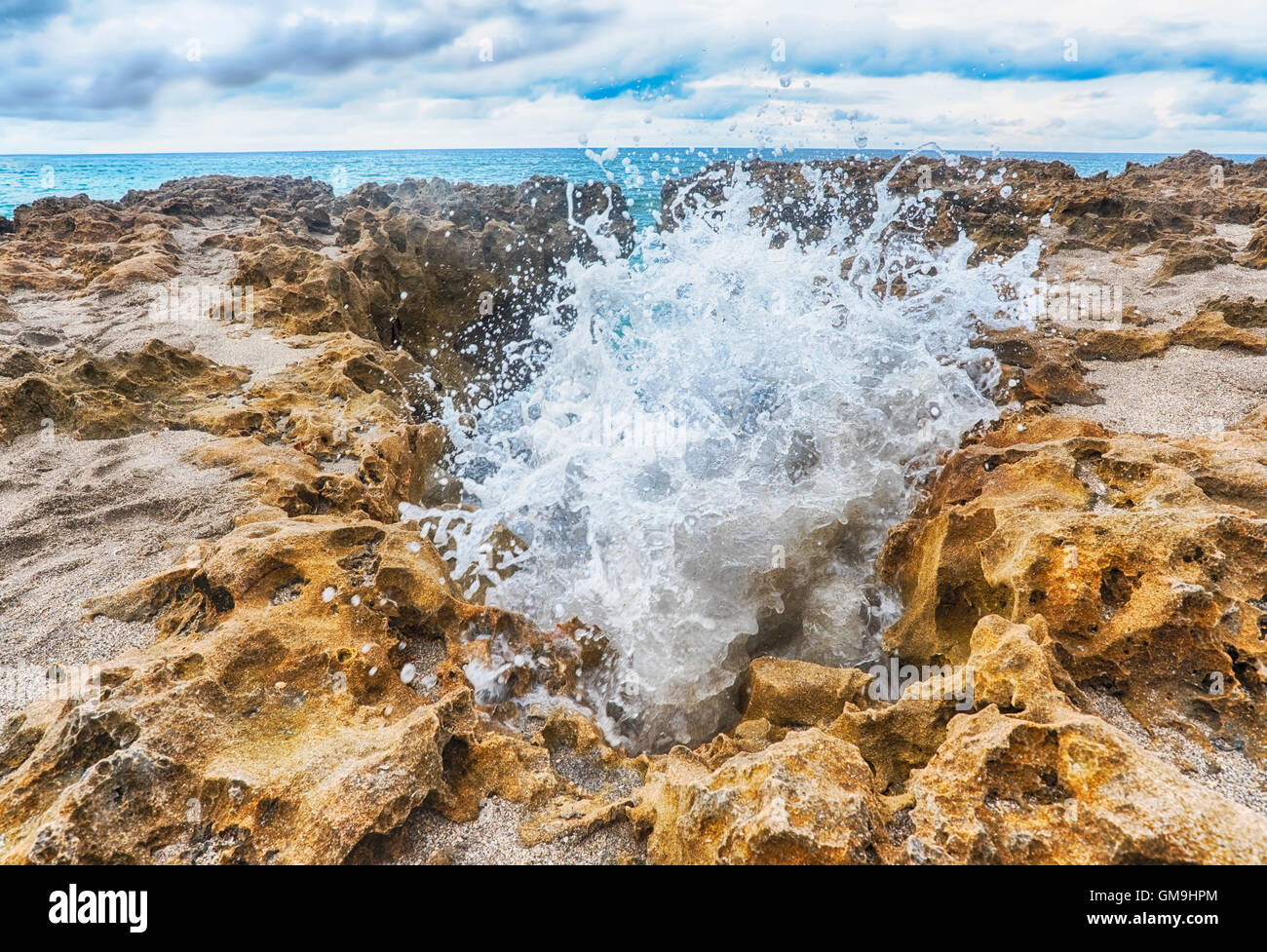 Splashing sea water on rock formation hi-res stock photography and ...