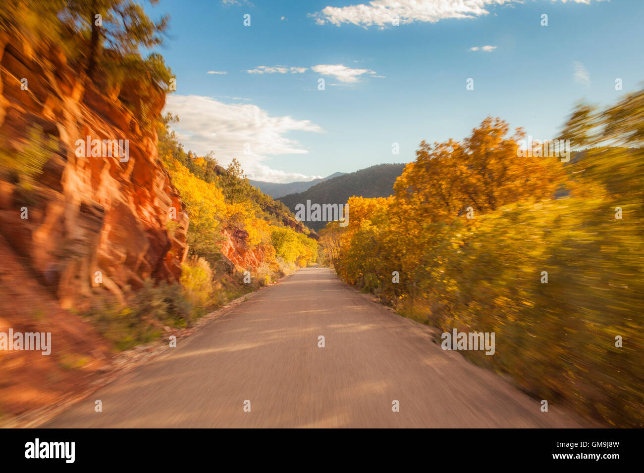 Empty country road at sunset, Colorado Stock Photo - Alamy