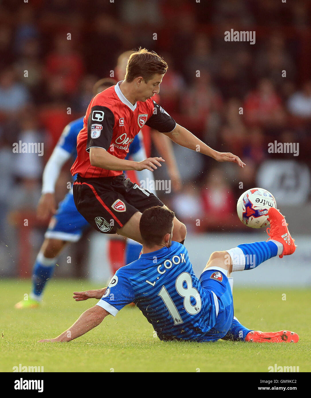 Morecambe's Andrew Fleming (left) and AFC Bournemouth's Lewis Cook ...