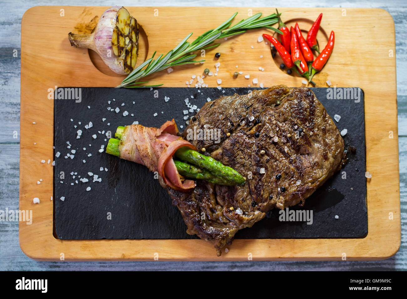 Cooked brown meat on board Stock Photo - Alamy