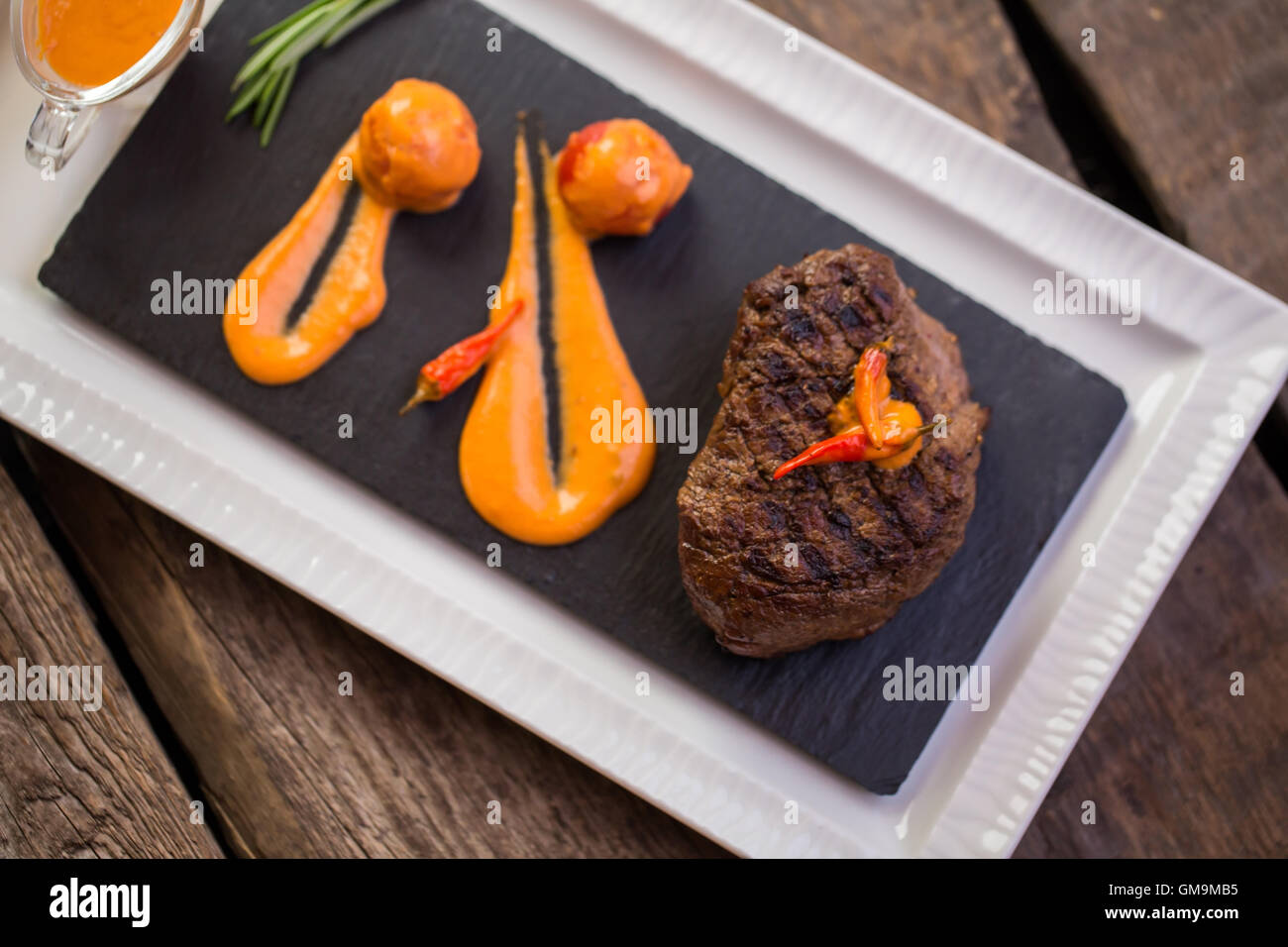 Meat with orange sauce Stock Photo - Alamy