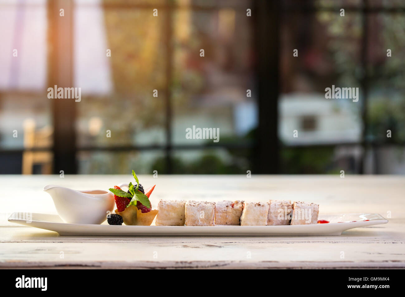 Dessert on long plate Stock Photo - Alamy