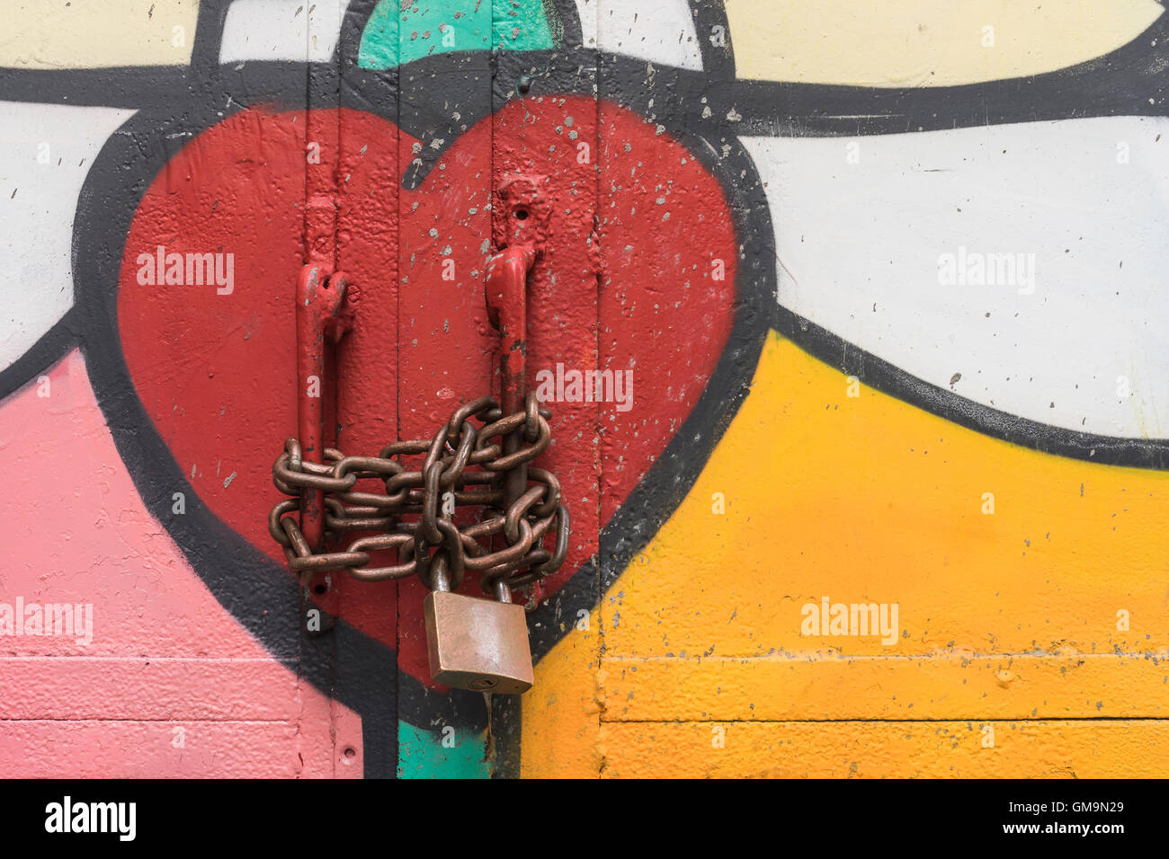 Graffiti on a locked front door Stock Photo - Alamy