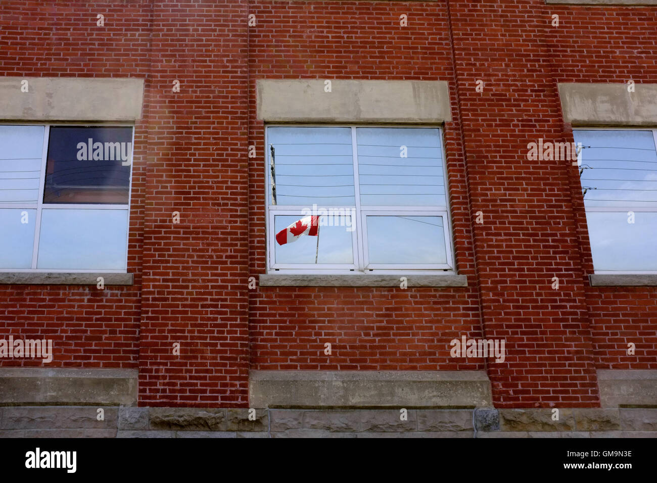 The Canadian flag reflected in an office window in London, Ontario ...