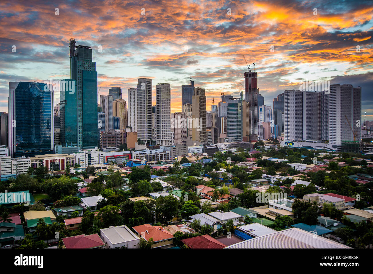 View of the skyline of Makati at sunset, in Metro Manila, The ...