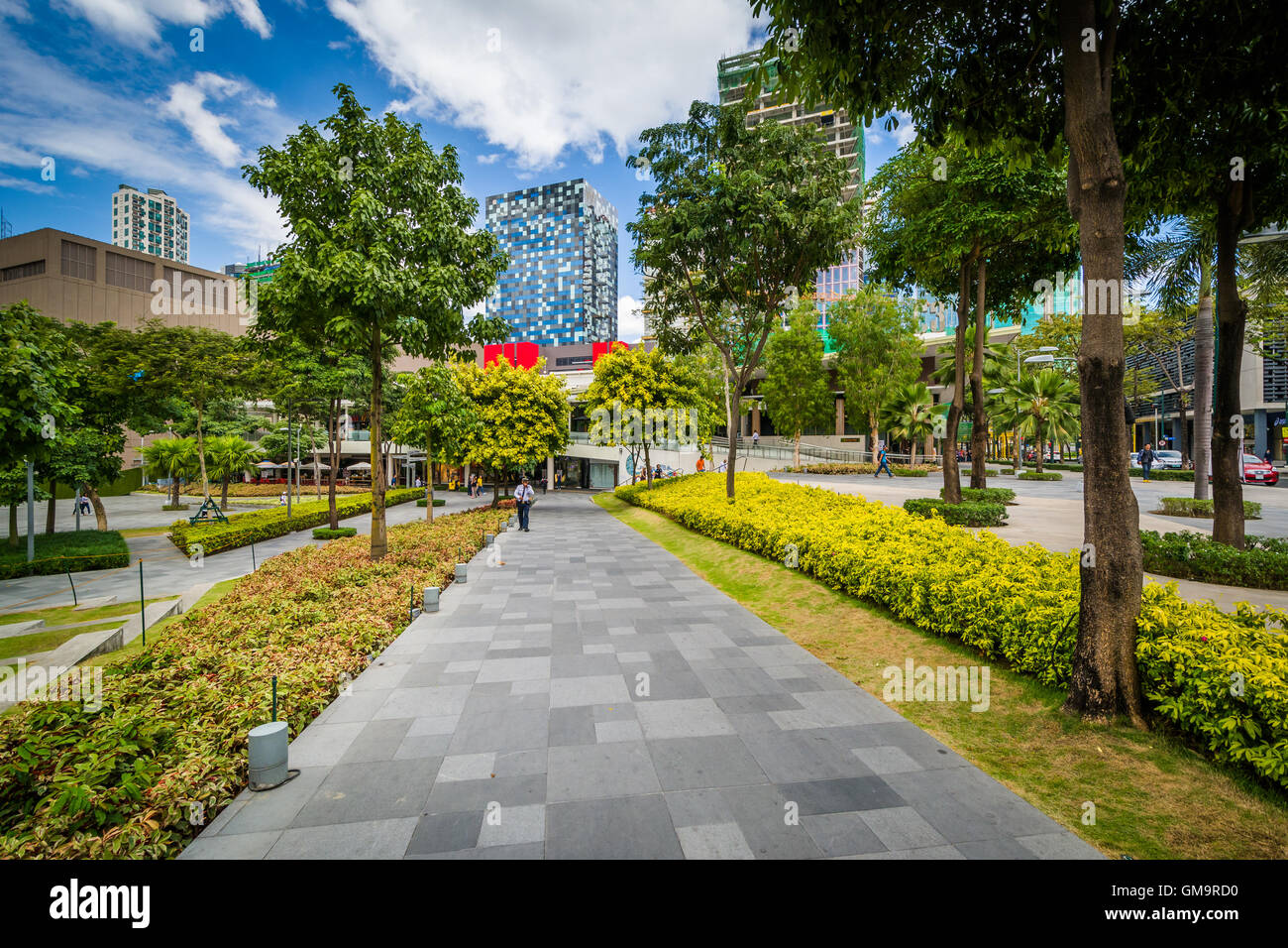 Walkway at a park and skyscrapers at Bonifacio Global City, in Taguig ...