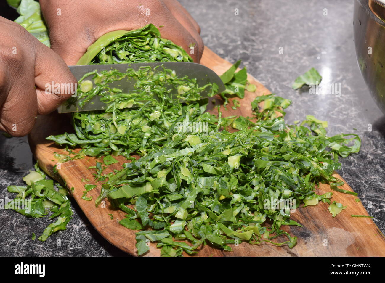Close-up of a Hand Chopping Greens Stock Photo - Alamy