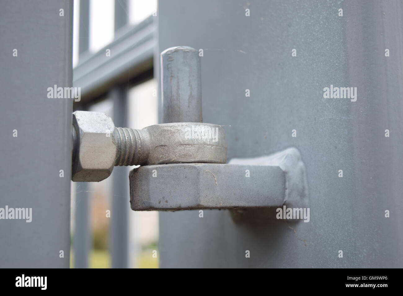 Hinge on a Silver Metal Gate Stock Photo - Alamy