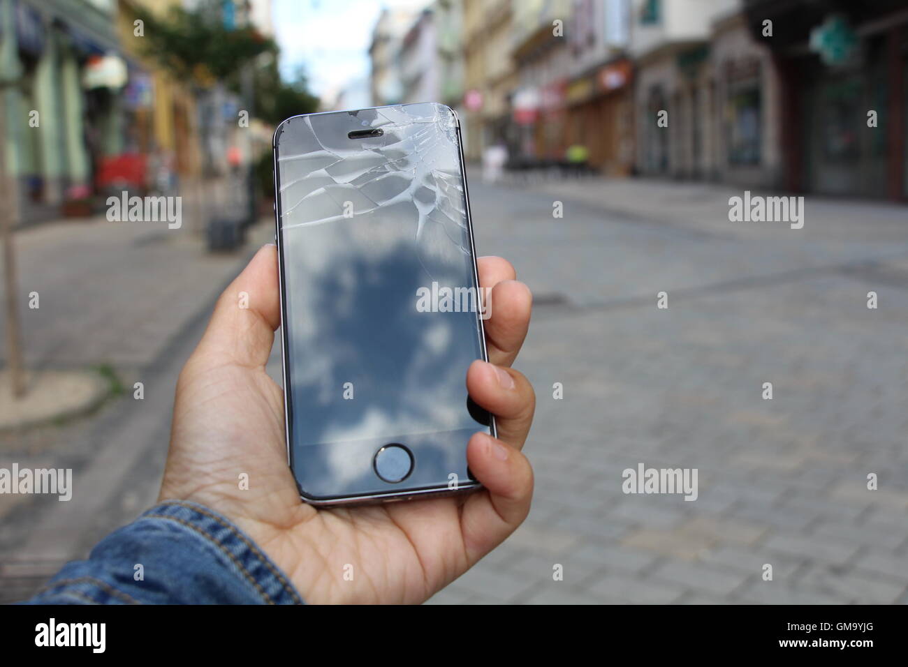 This iPhone5 by Apple is damaged and thus it does not work Stock Photo ...