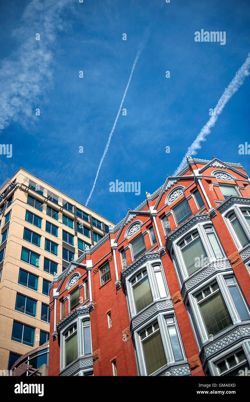 Look up to high buildings and contrails Stock Photo - Alamy