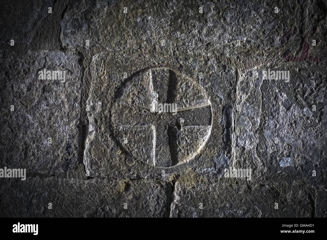 Cross carved on one of the stones of the crypt of the church of San ...