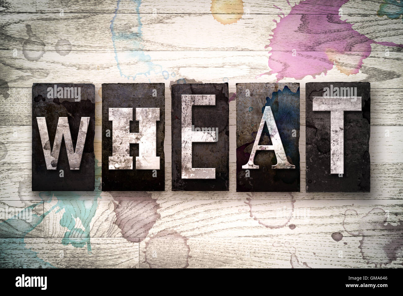 The word "WHEAT" written in vintage dirty metal letterpress type on a ...