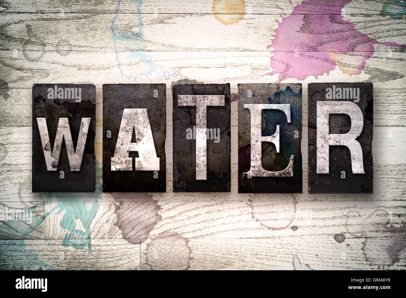 The word "WATER" written in vintage dirty metal letterpress type on a ...