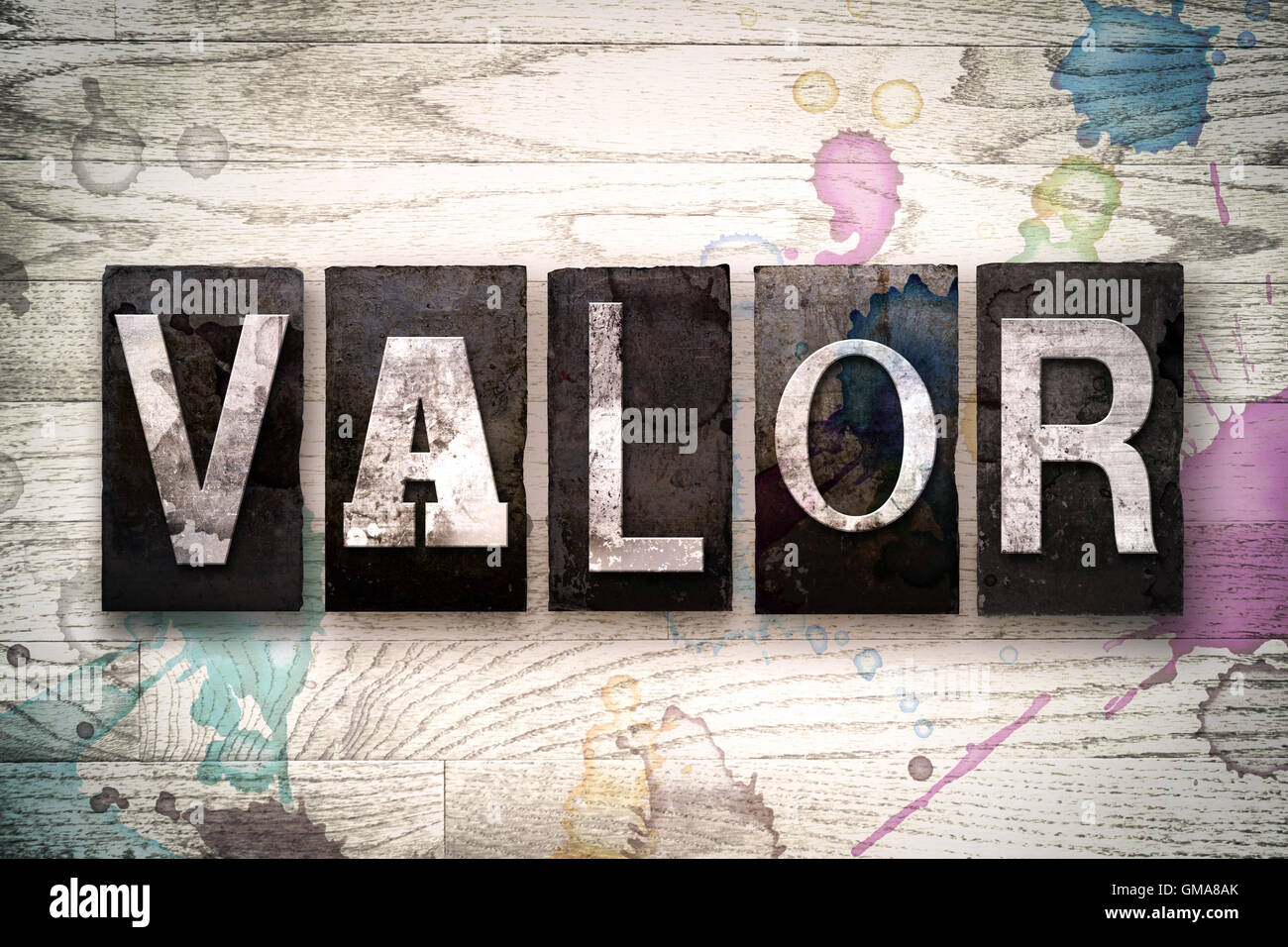 The word "VALOR" written in vintage dirty metal letterpress type on a ...